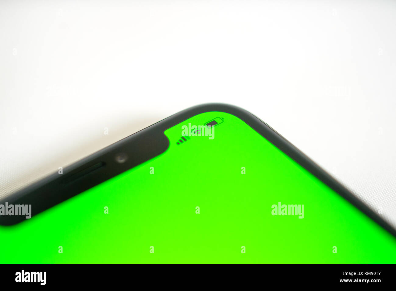 Side view detail of smartphone detail with chroma green screen and ...