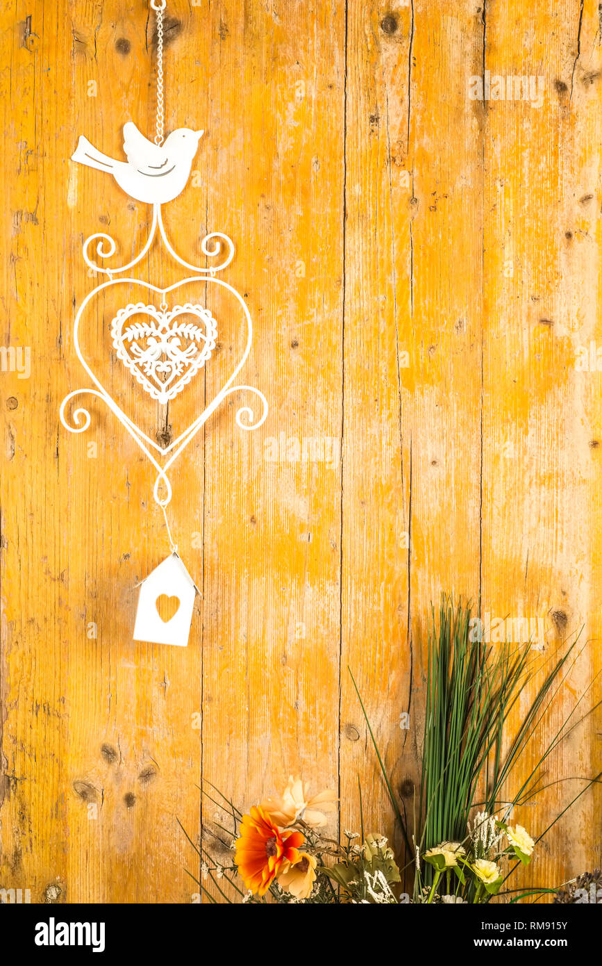Romantic rustic background, flowers and bird decoration in rustic wood ...