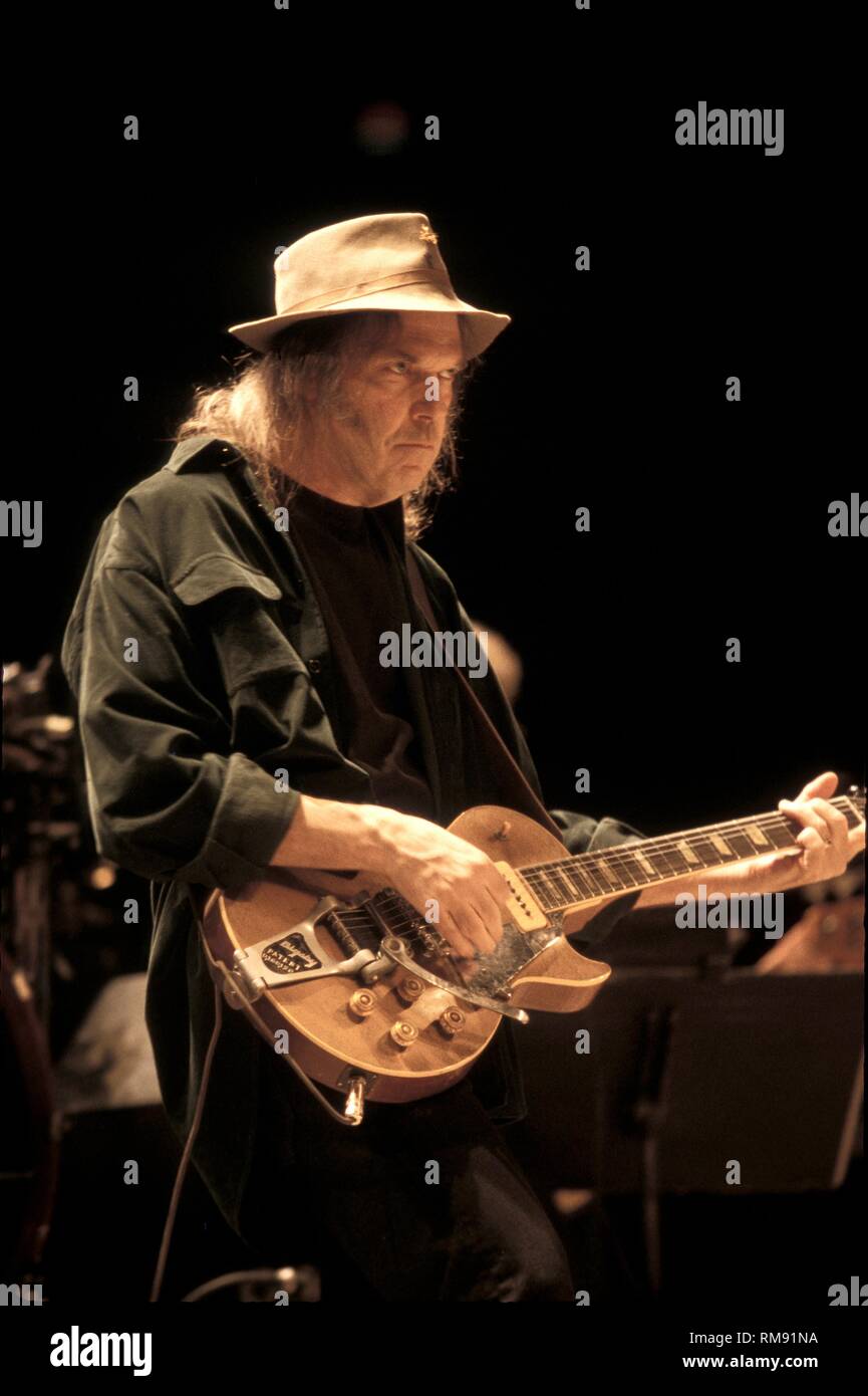 Neil Young is shown performing on stage during a CSN&Y concert Stock ...