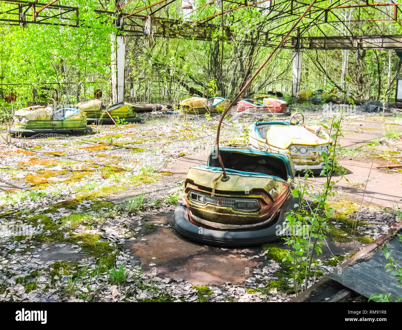Pripyat, an abandoned playground with cars. Pripyat, an abandoned ...