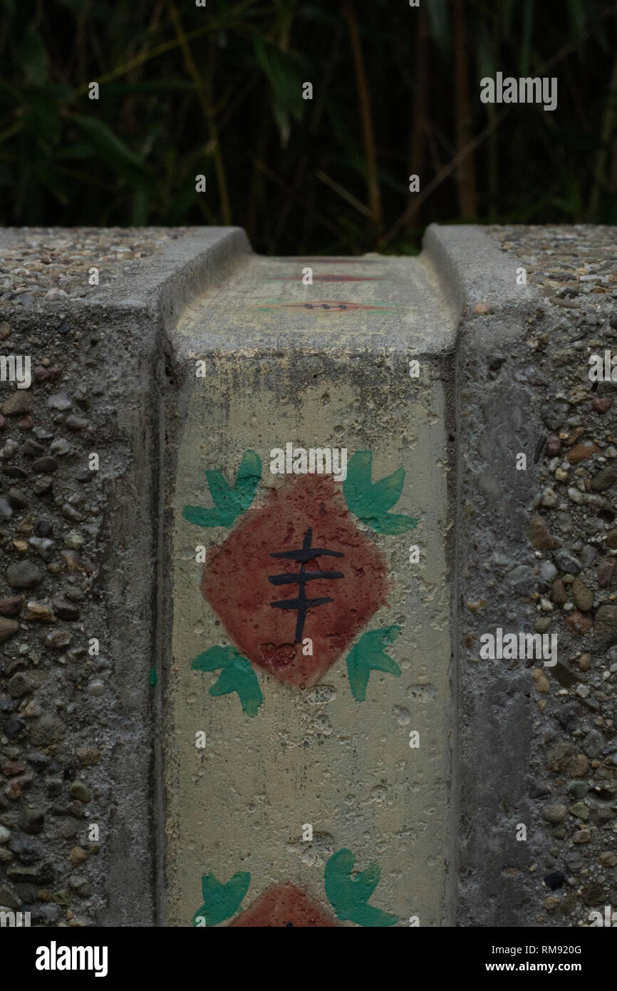 Hand-Painted Asian Symbol on Stone With Dark Bamboo Background Stock ...
