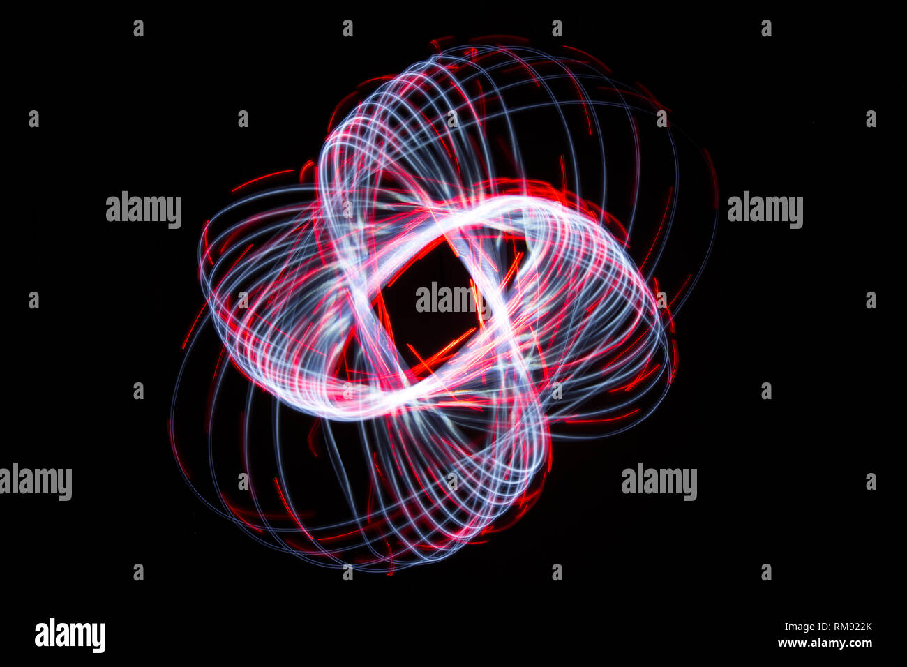 Light painting forming an elliptic shape with blueish continuous white ...