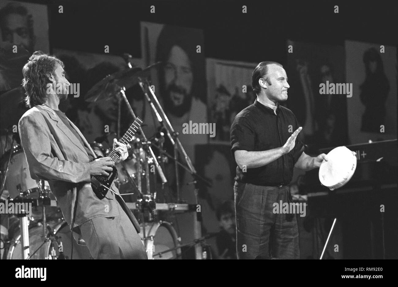 Genesis vocalist Phil Collins is shown performing on stage during a ...