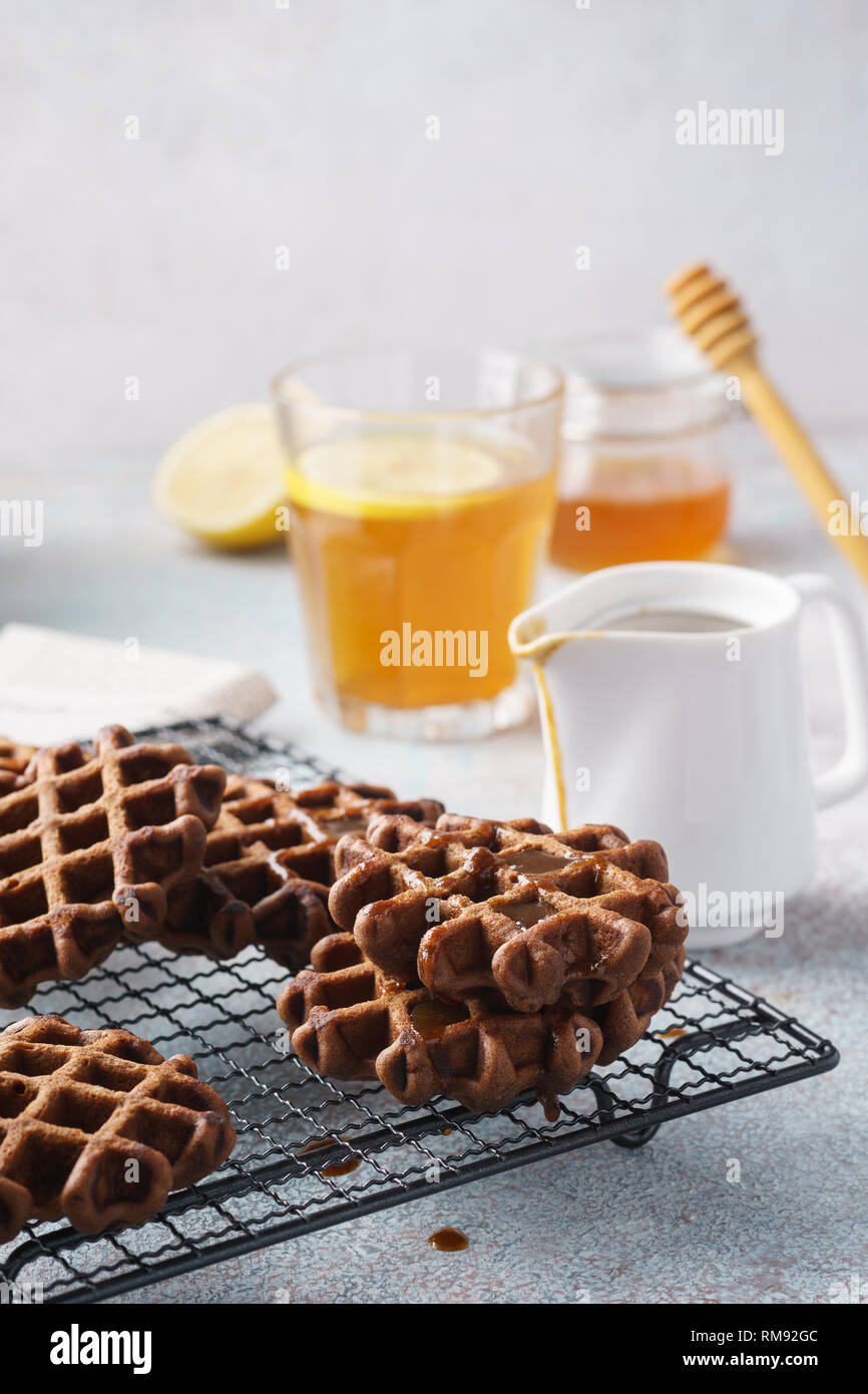 Chocolate Belgium waffles served with caramel syrup for breakfast Stock ...