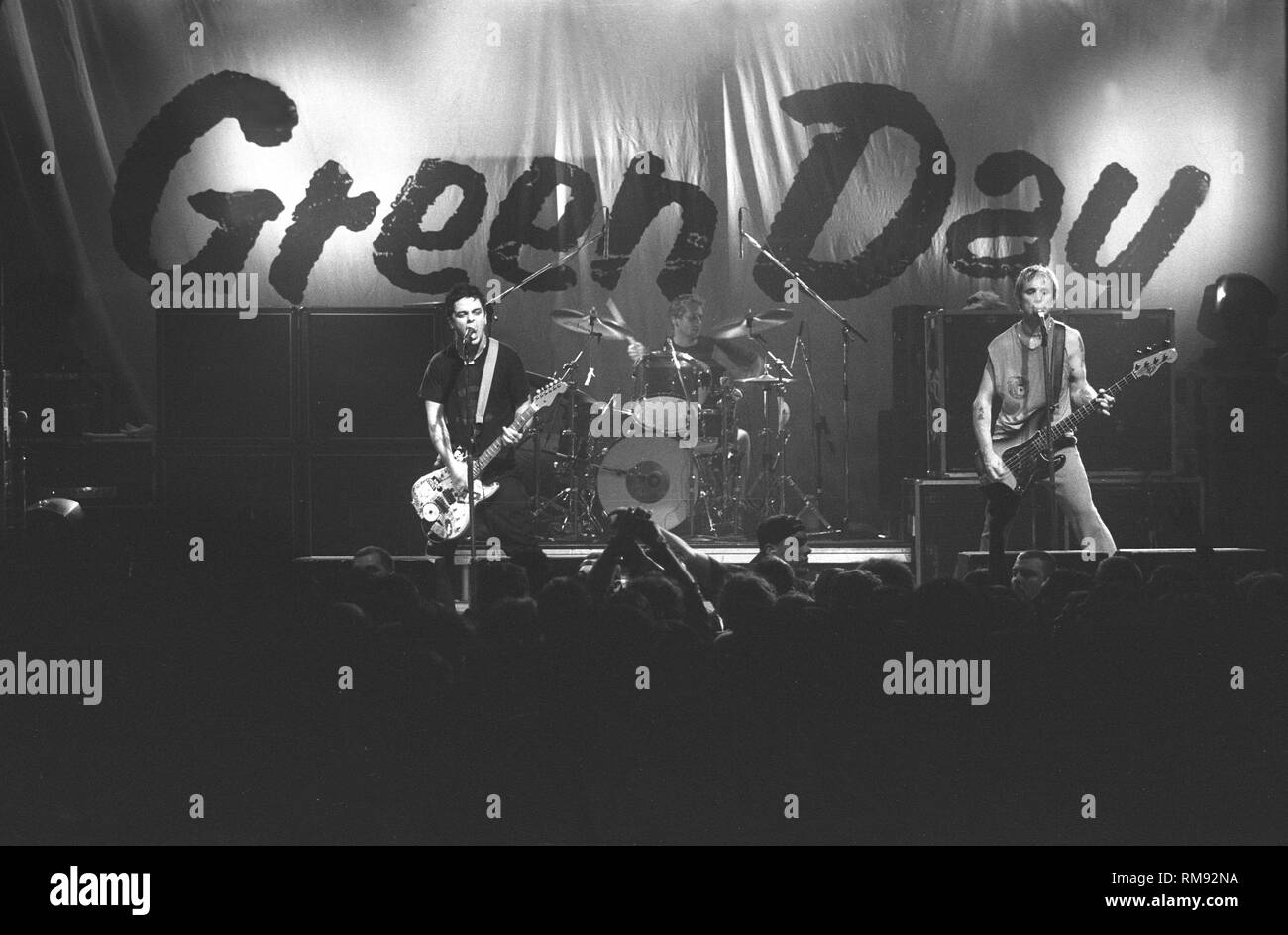 The rock trio Green Day are shown performing on stage during a "live ...