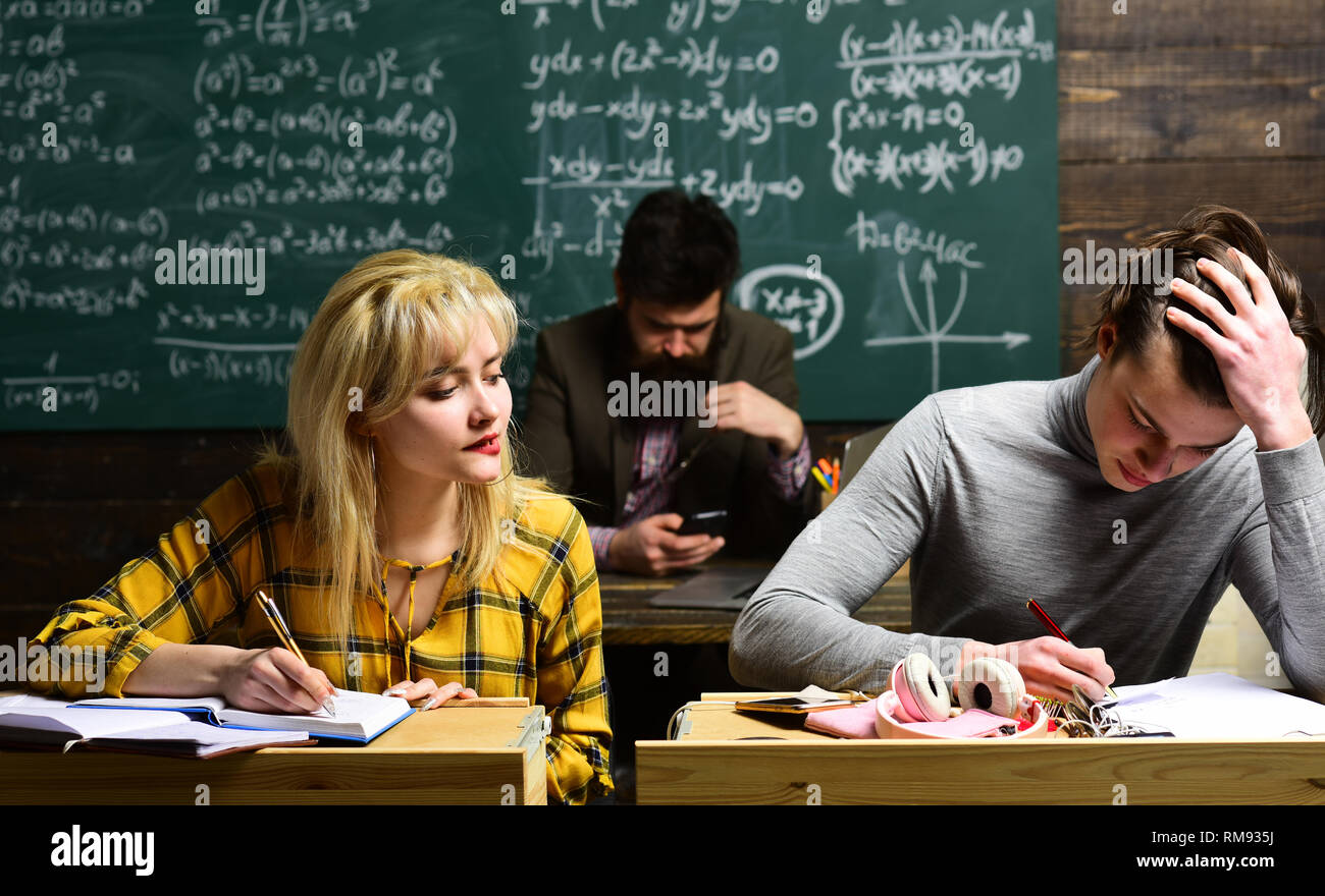 Student writing composition for annual exams preparation. Making time ...