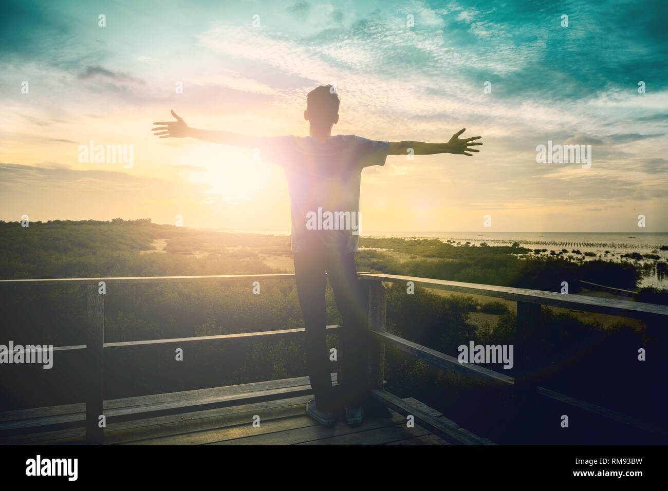 Silhouette man happy with hands rise up on beautiful. Christian praise ...