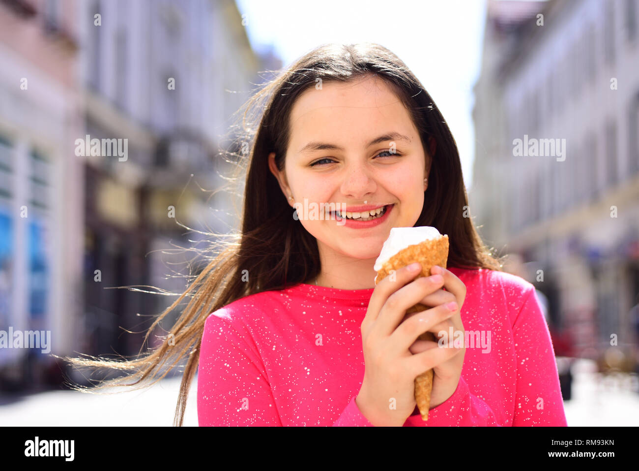 Enjoying frozen food snack or dessert. Cute girl smiling with ice cream ...