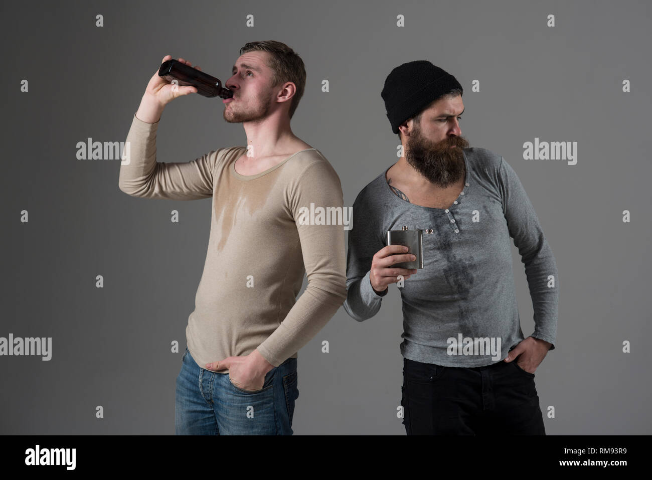 Suffering with alcohol addiction and alcoholism. Men drinking alcohol ...