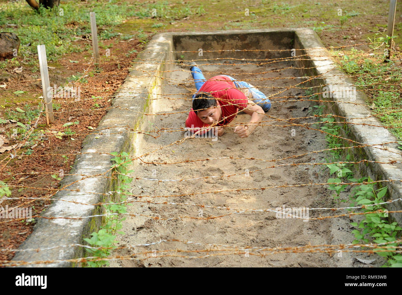 Crawling under wire hi-res stock photography and images - Alamy