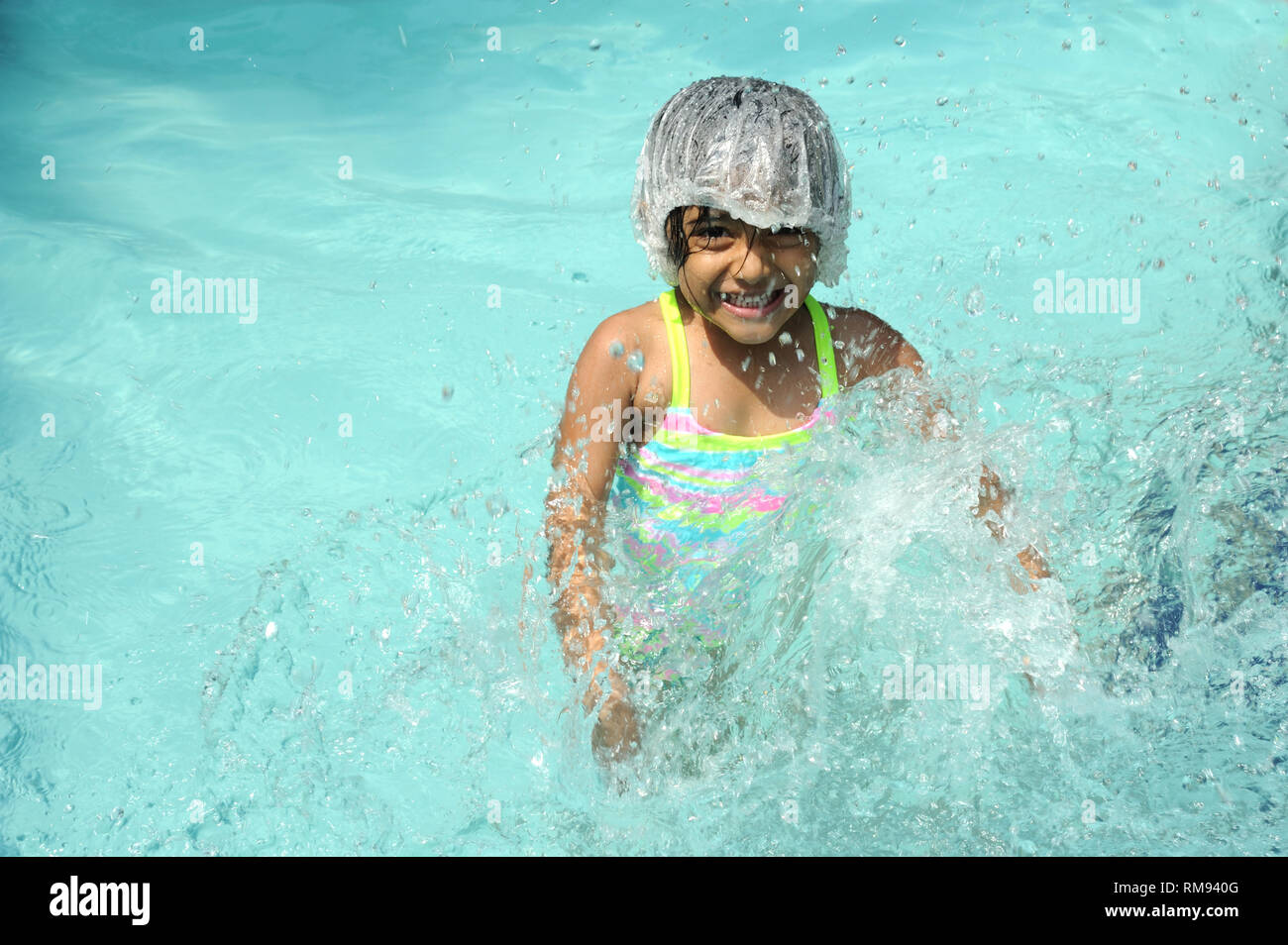 Child splashing in water hi-res stock photography and images - Alamy