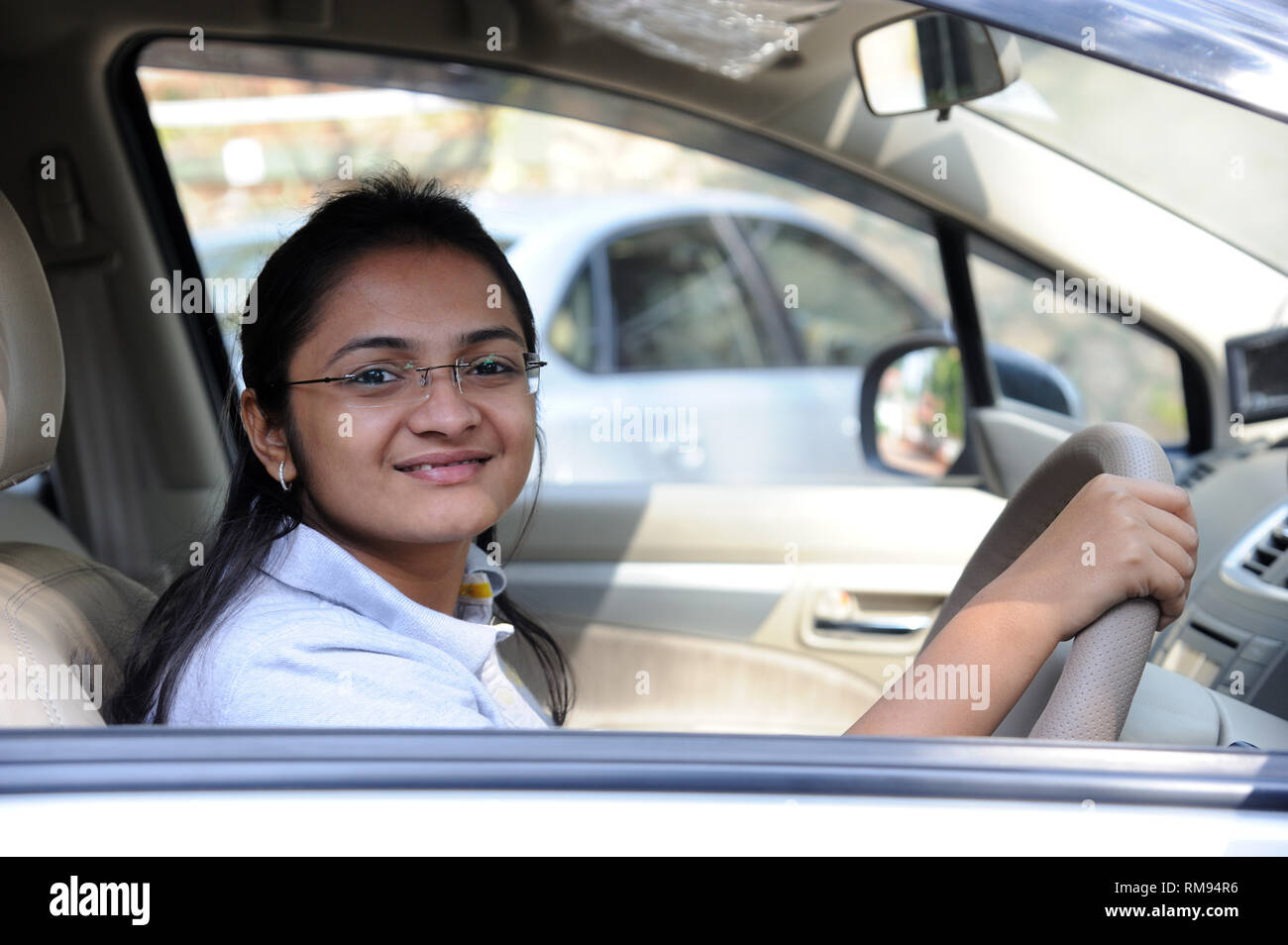 Girl driving car Stock Photo - Alamy