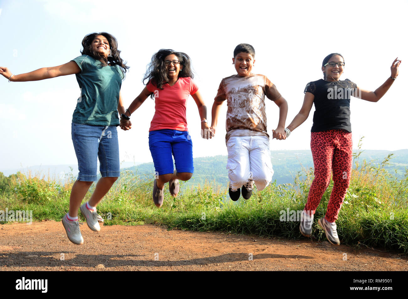 Indian kids jumping hi-res stock photography and images - Alamy