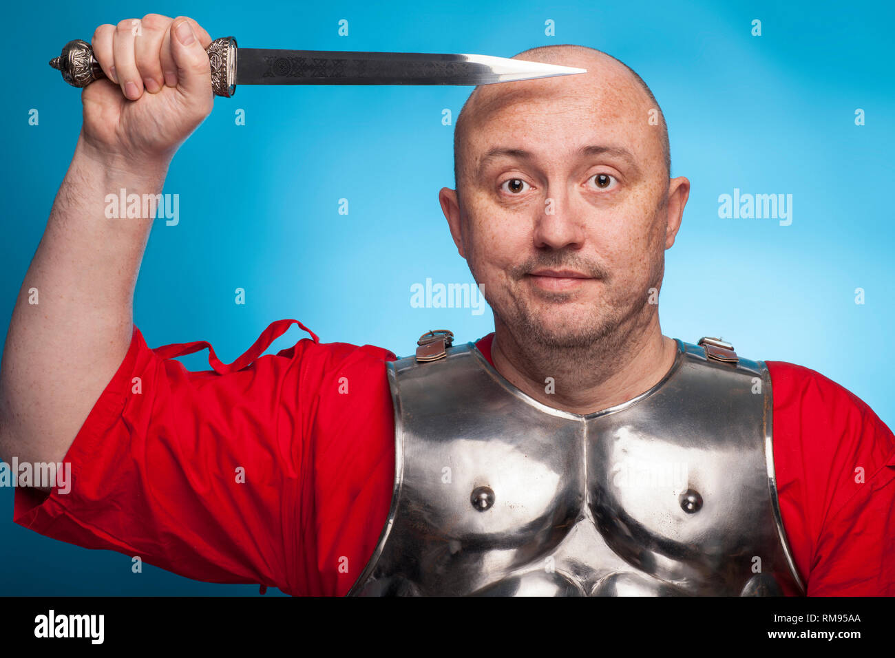 A roman soldier with with a dagger, knife on the blue background Stock ...