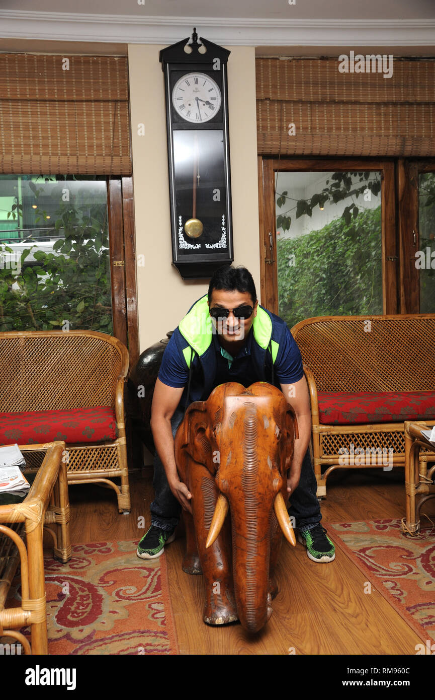 Indian man sitting on elephant hi-res stock photography and images - Alamy