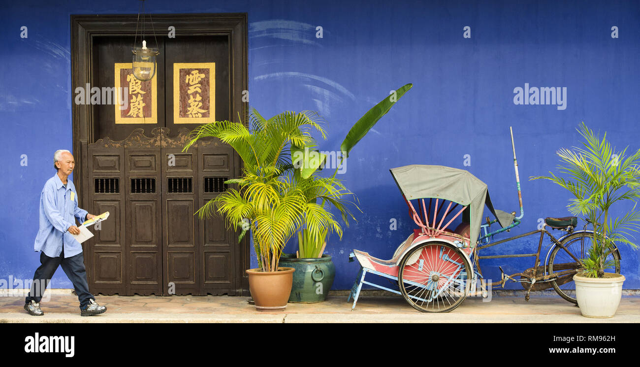 old rickshaw and timber door in the Cheong Fatt Tze, The Blue Mansion ...