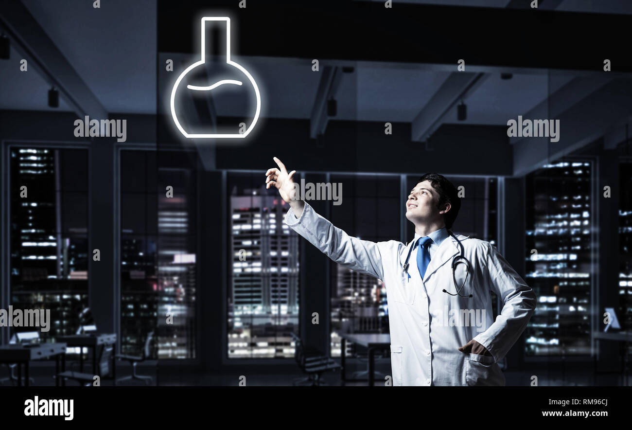 Doctor and medical vial symbol Stock Photo - Alamy