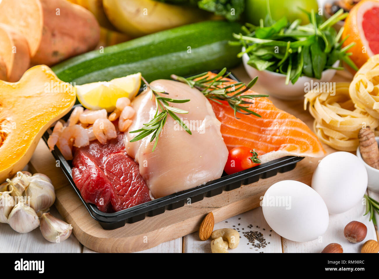 Balanced diet concept - fresh meat, fish, pasta, fruits and vegetables ...