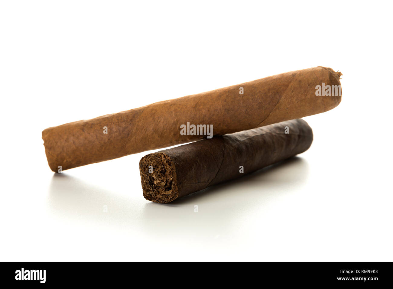 A strong and a mild cigar isolated on white background Stock Photo - Alamy
