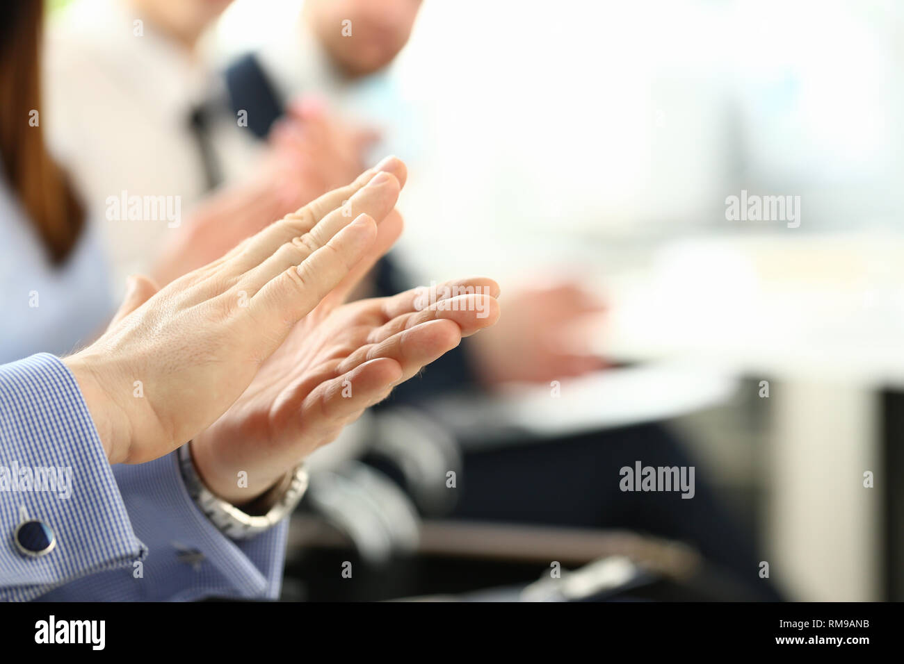 Group of people clap their arm in row during seminar Stock Photo - Alamy