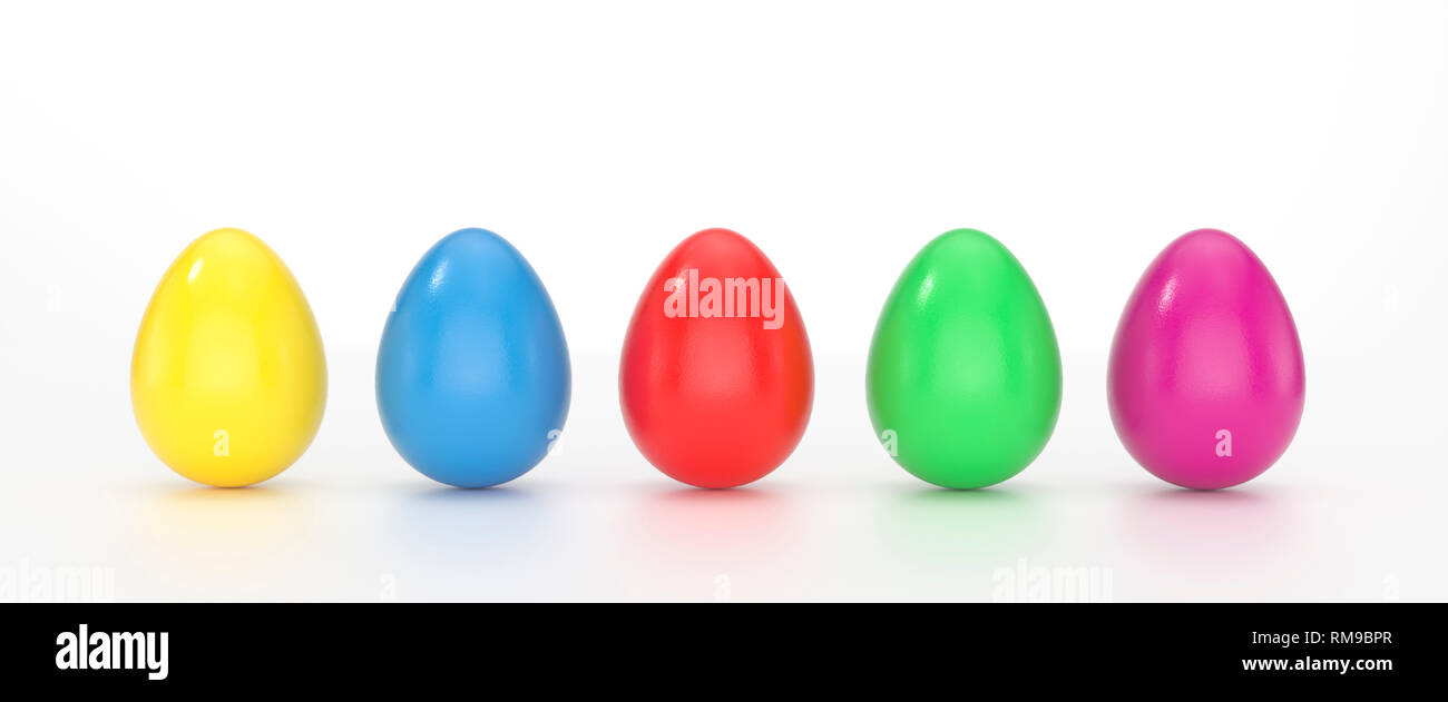 Green, cyan and pink colored Easter eggs balanced on its blunt end on ...