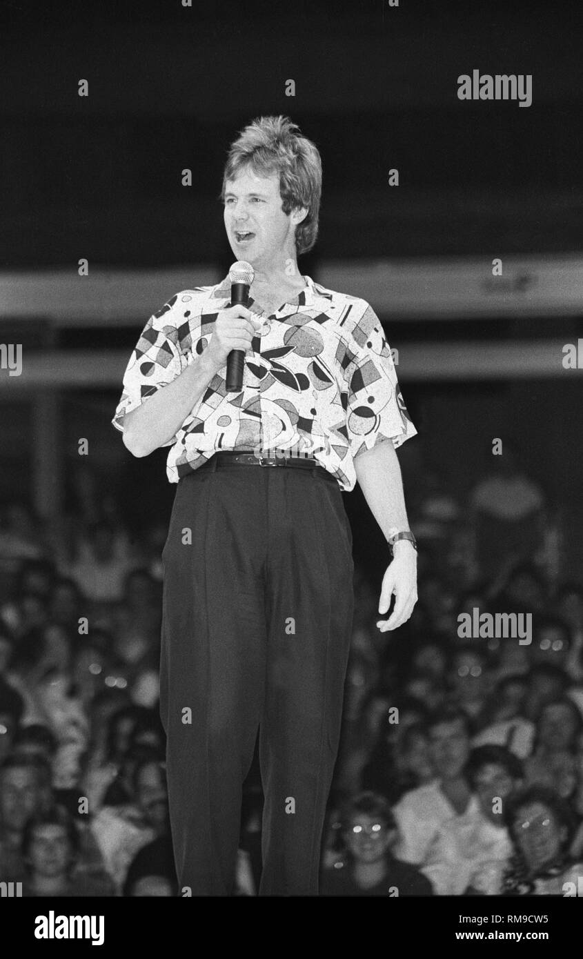 Comedian Dana Carvey is shown performing on stage during a "live ...