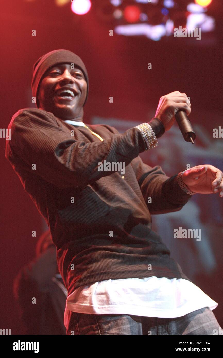 Rapper Cassidy is shown performing on stage during a "live" concert ...