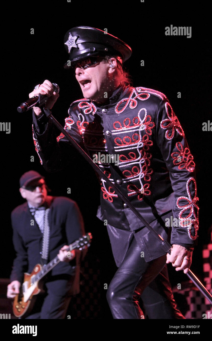 Singer Robin Zander is shown performing on stage during a "live ...