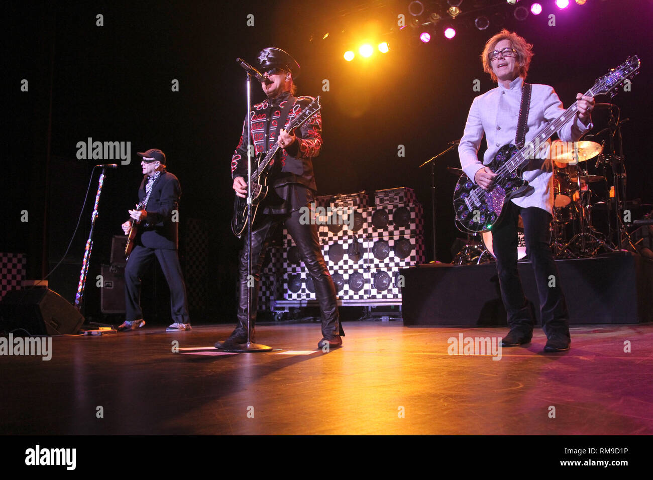 Singer Robin Zander is shown performing on stage during a "live ...