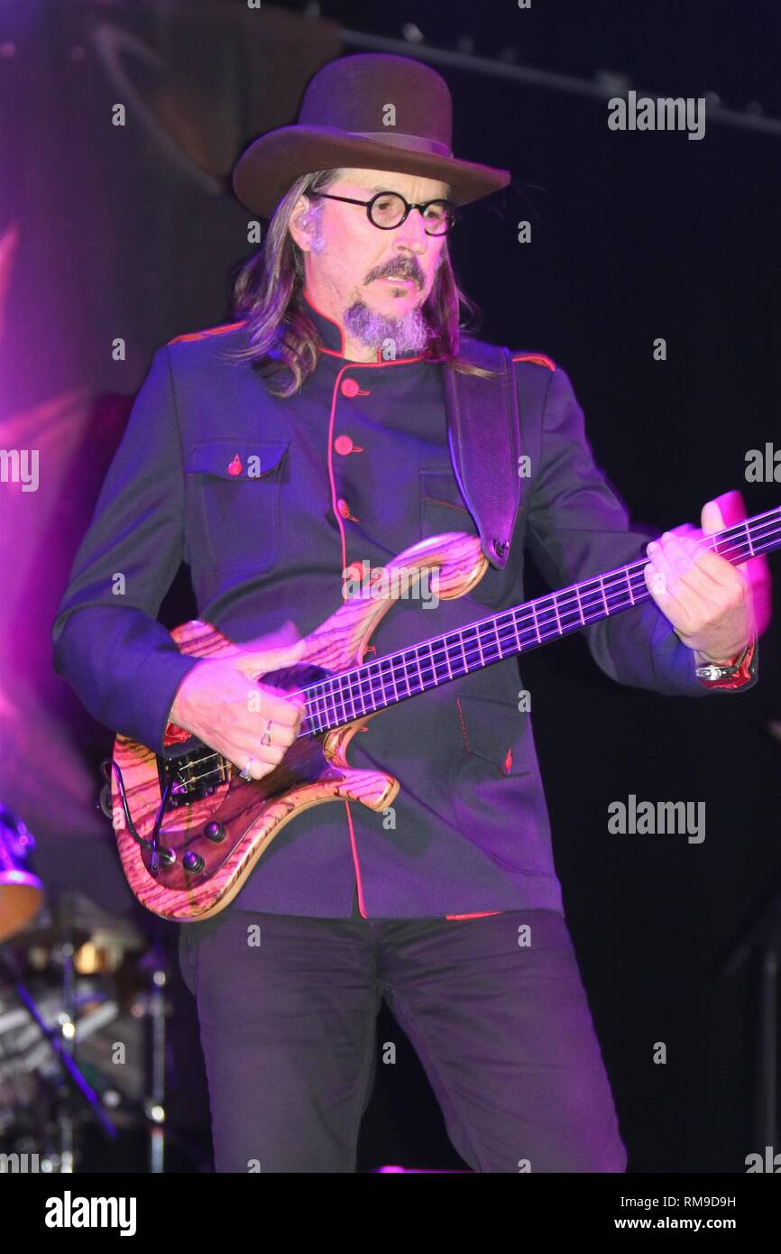 Bassist Les Claypool is shown performing on stage during a "live ...