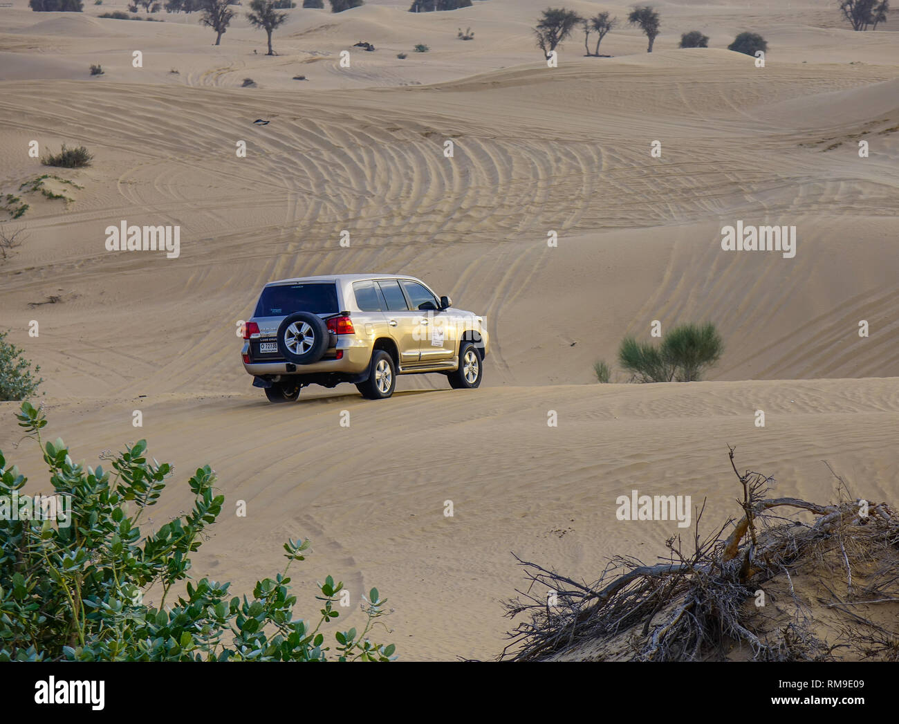 Dubai, UAE - Dec 5, 2018. SUV car (4x4) on Dubai desert. Driving in the ...