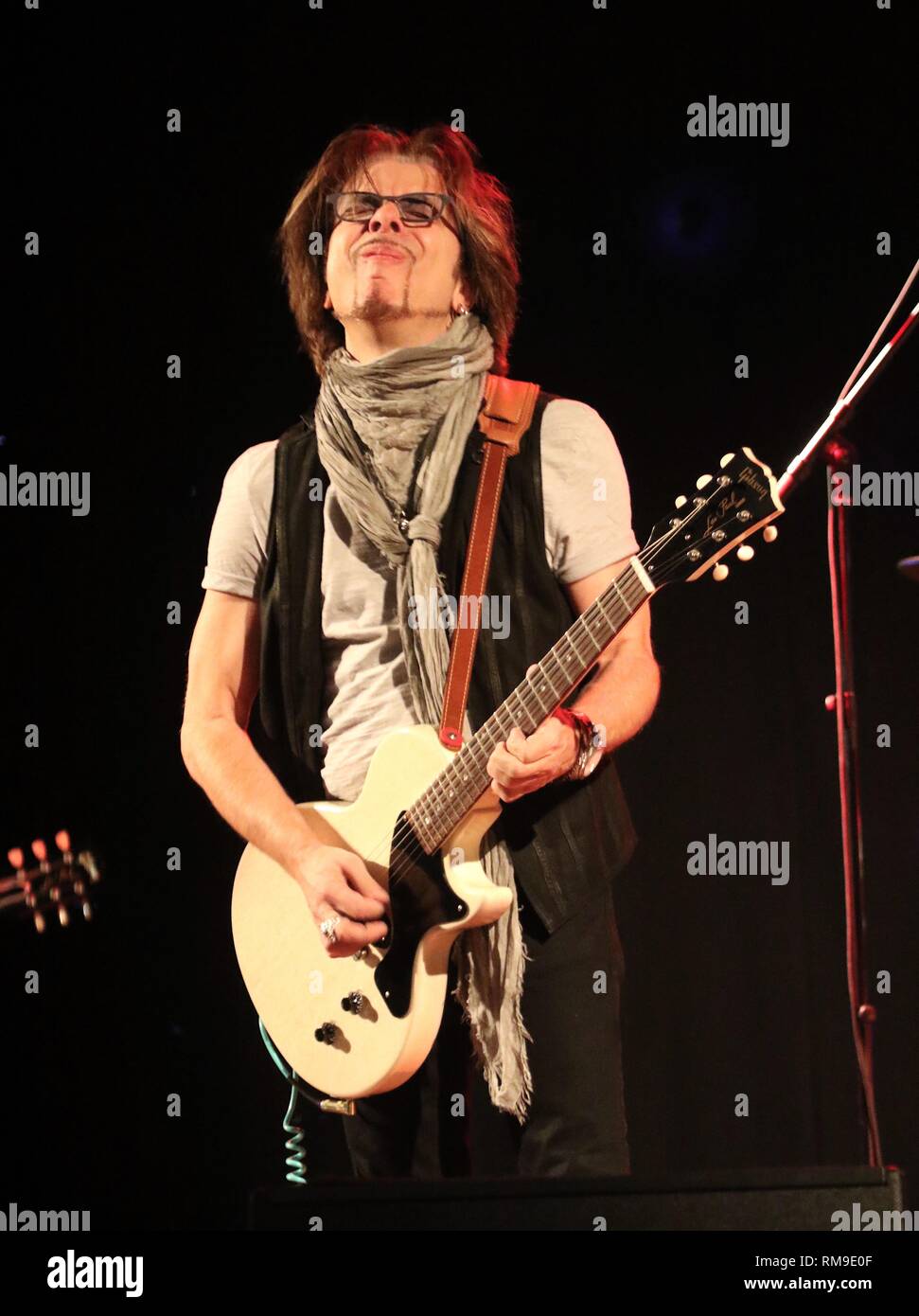 Guitarist Johnny A (Antonopoulos) is shown performing on stage during a ...