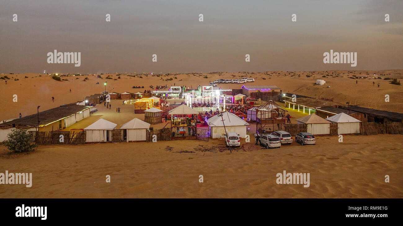 Dubai, UAE - Dec 5, 2018. Bedouin camp on the Dubai desert at sunset ...