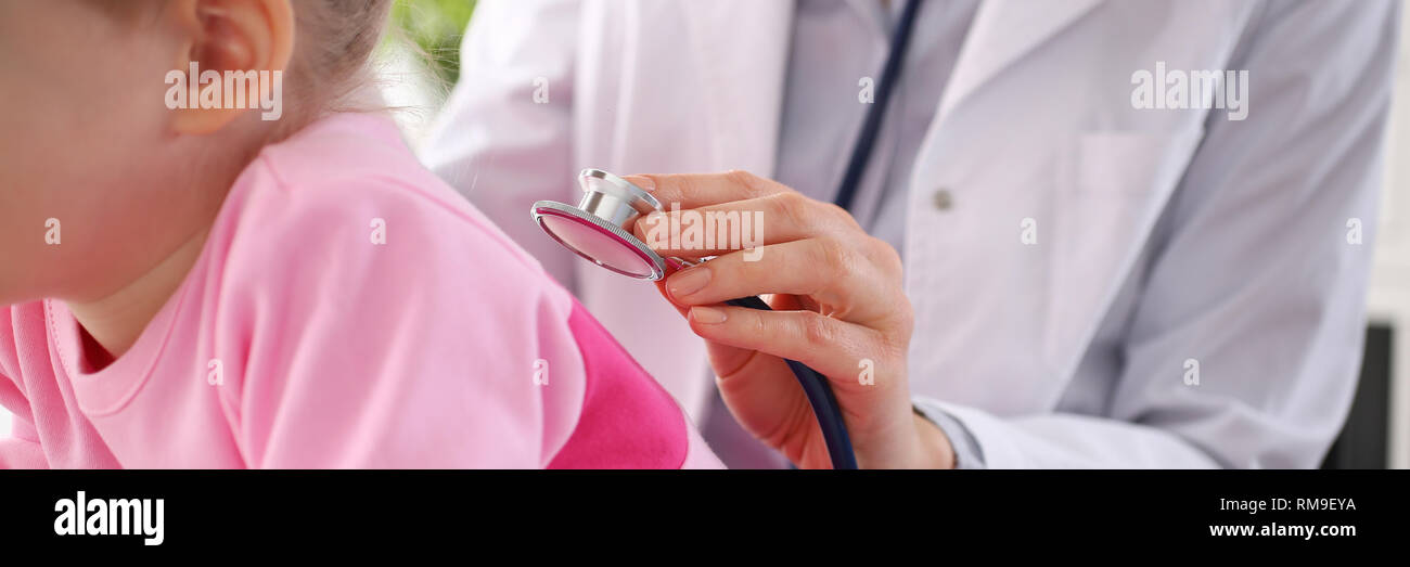 Little child with stethoscope at doctor reception Stock Photo - Alamy