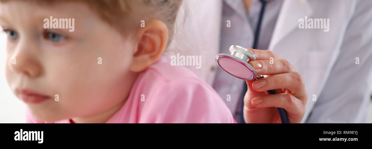 Little child with stethoscope at doctor reception Stock Photo - Alamy