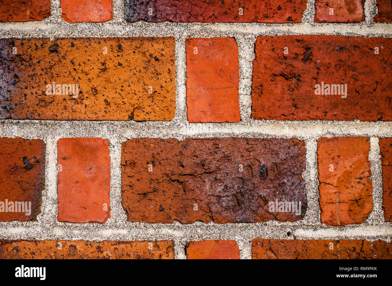 A wall of red brick, made of burned clay, and folded according to the ...