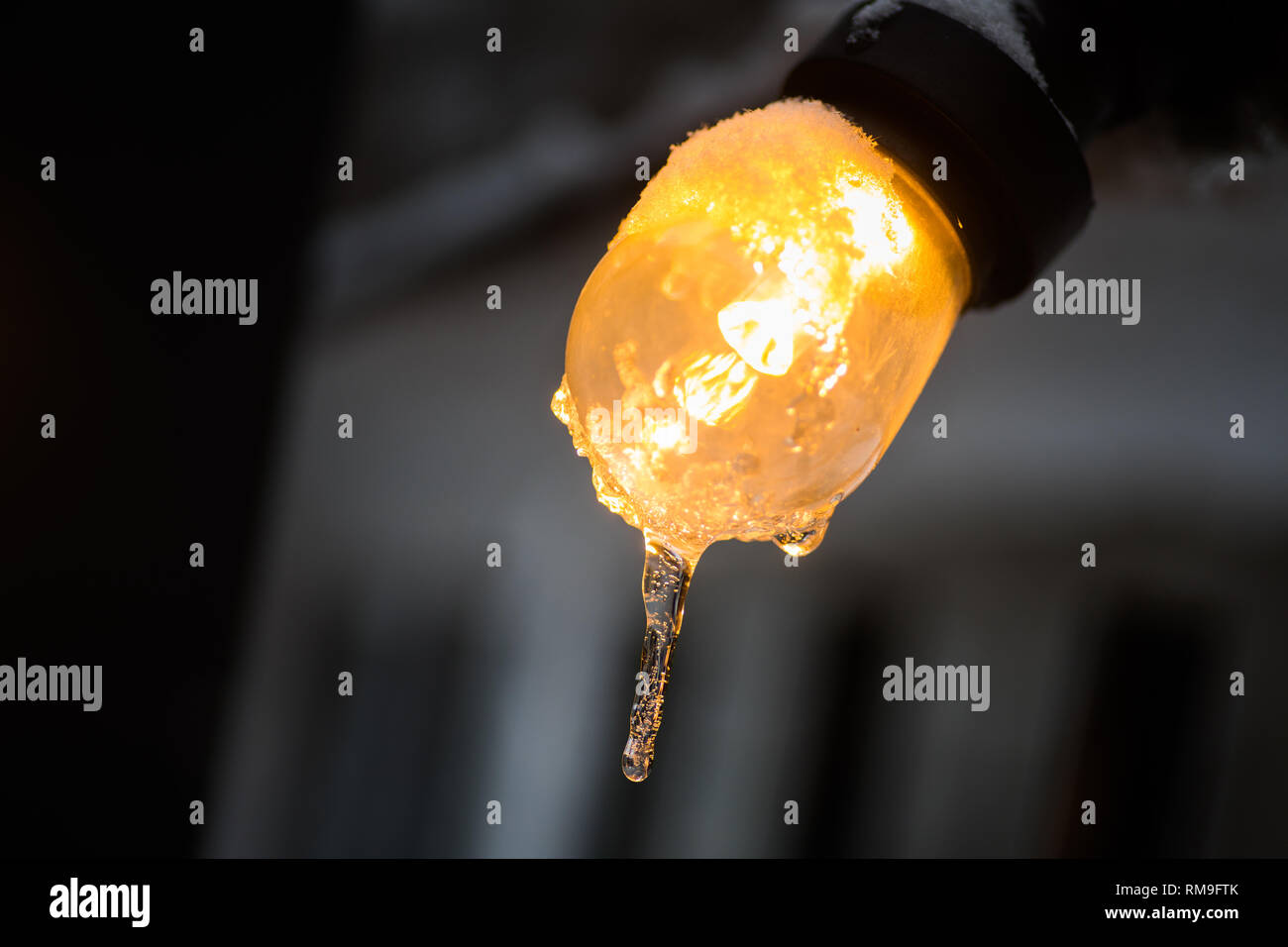 Color image of a frozen lit light bulb Stock Photo - Alamy