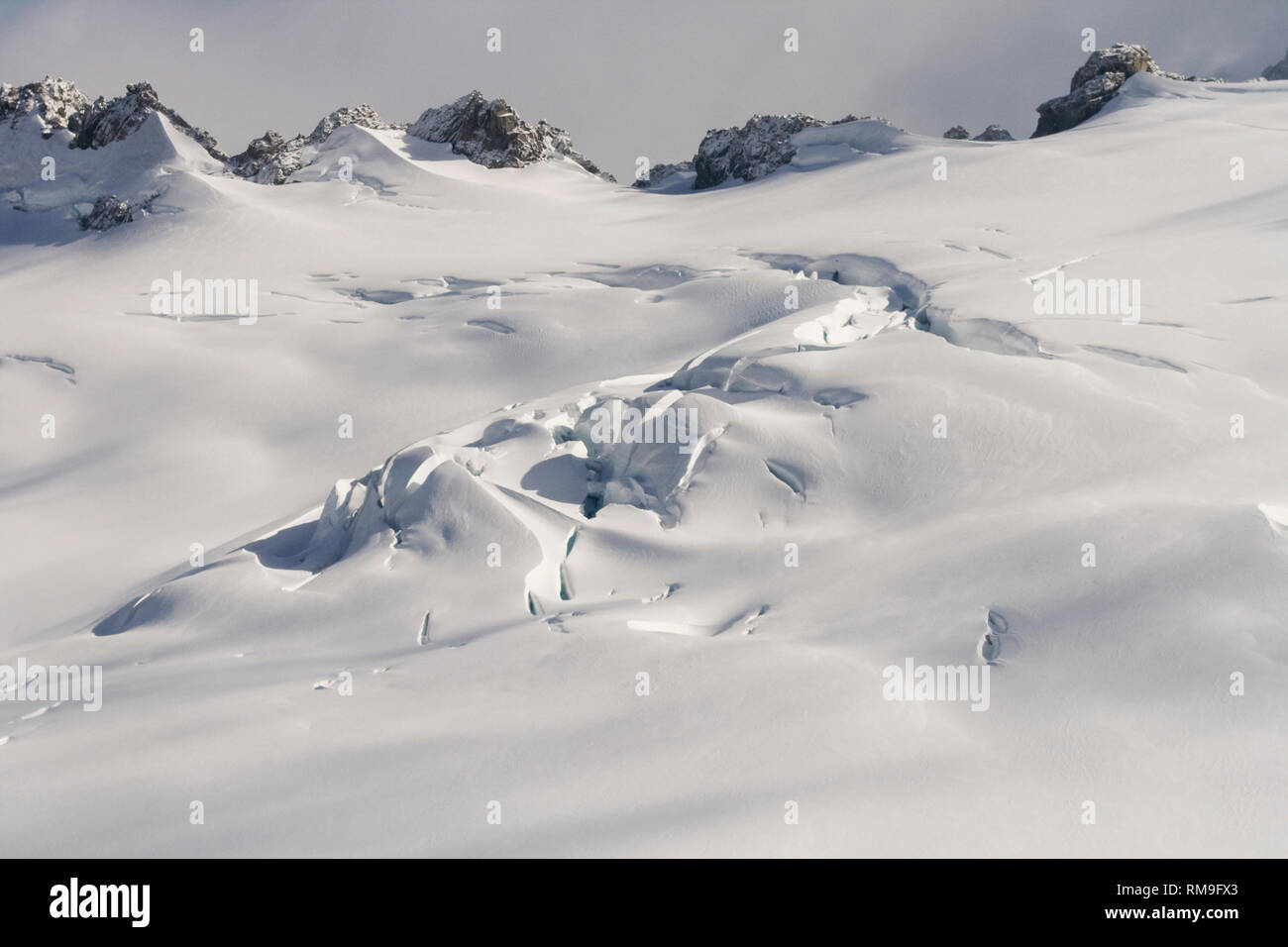 Fresh snow on glacier Stock Photo - Alamy