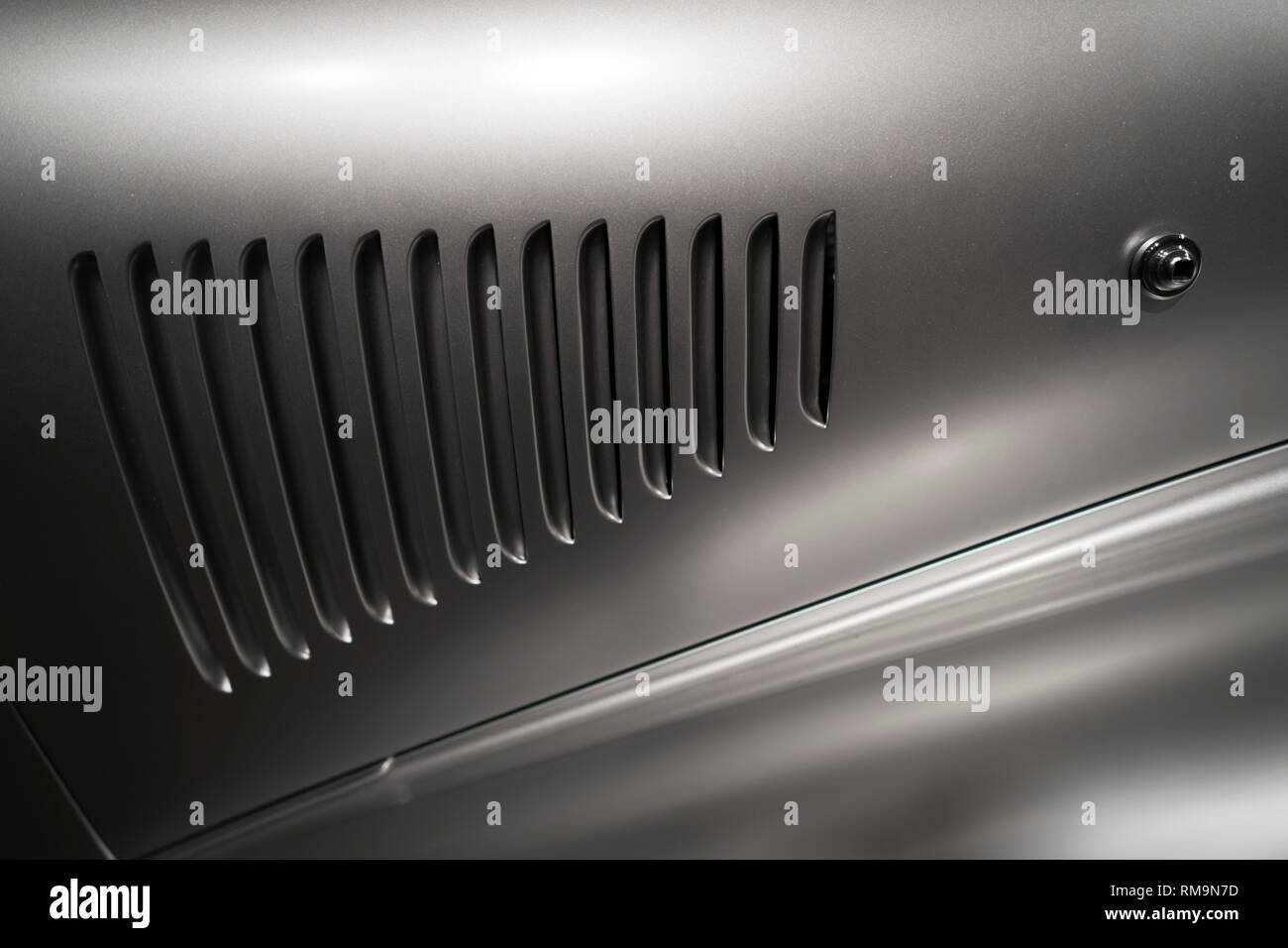 Side of old vintage car with a streamlined aerodynamic body shape with ...