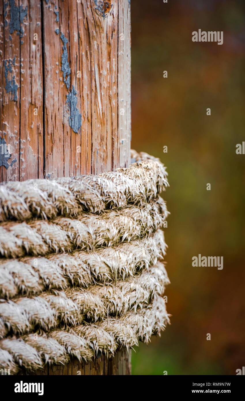 Powerful thick old braided natural hemp ship rope, strayed from long ...