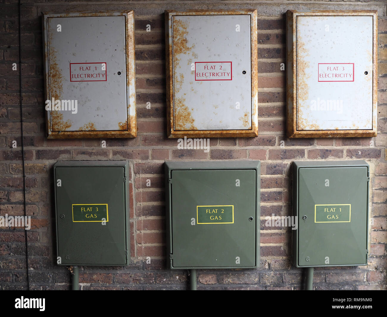 Communal flat external electricity and gas meter boxes Stock Photo - Alamy