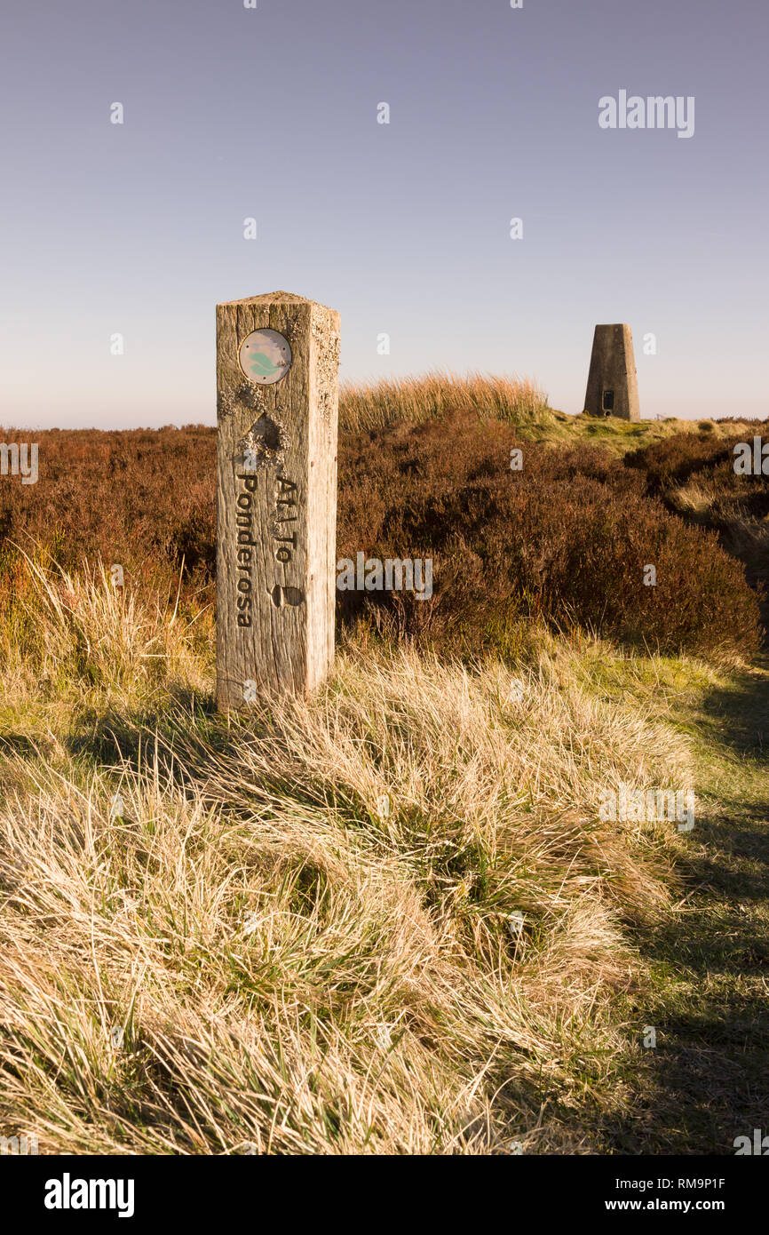 Sign post and trail with the trig point at Sir Watkins Tower on Cyrn y ...