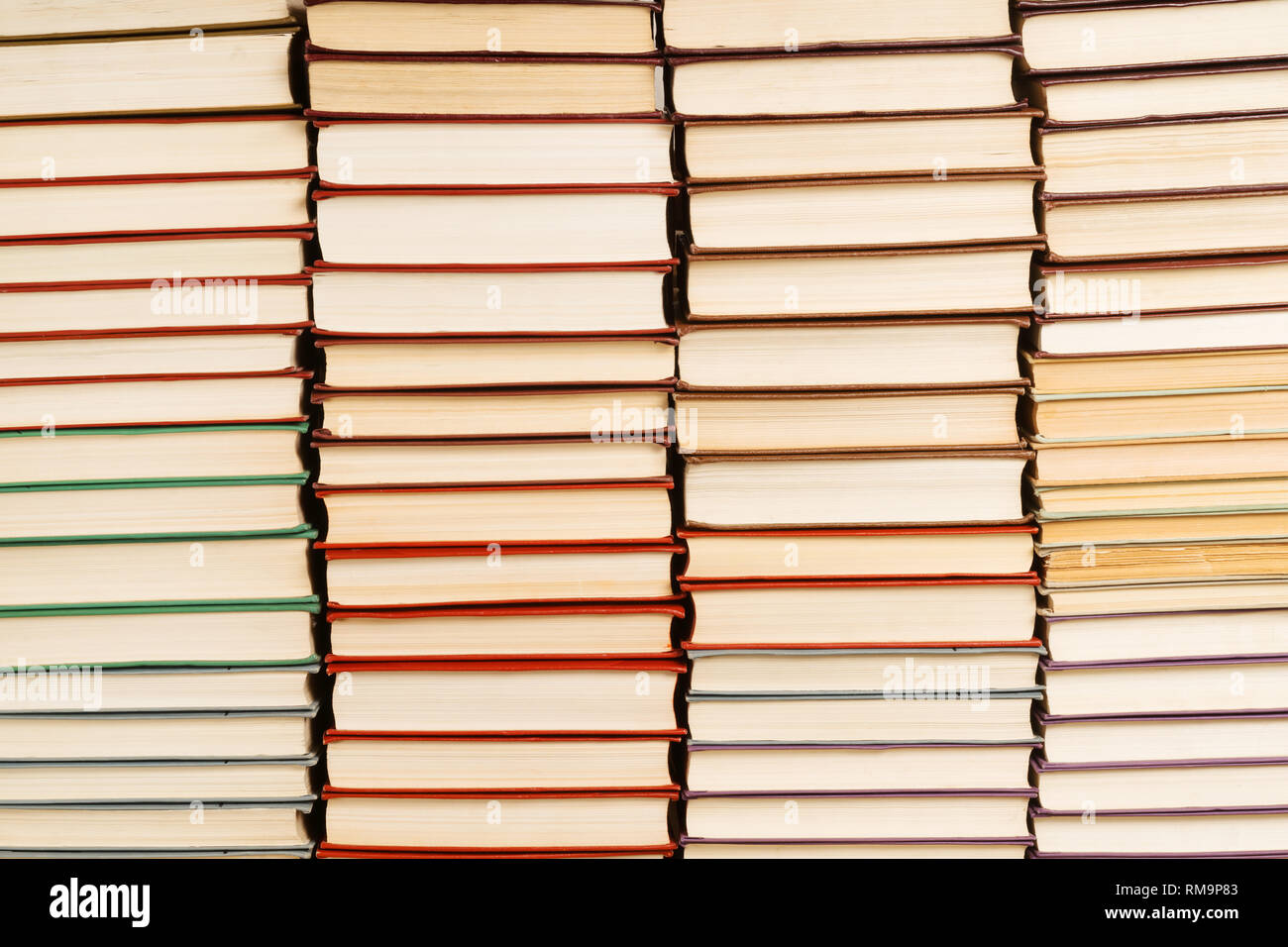 Books pile texture and background Stock Photo - Alamy