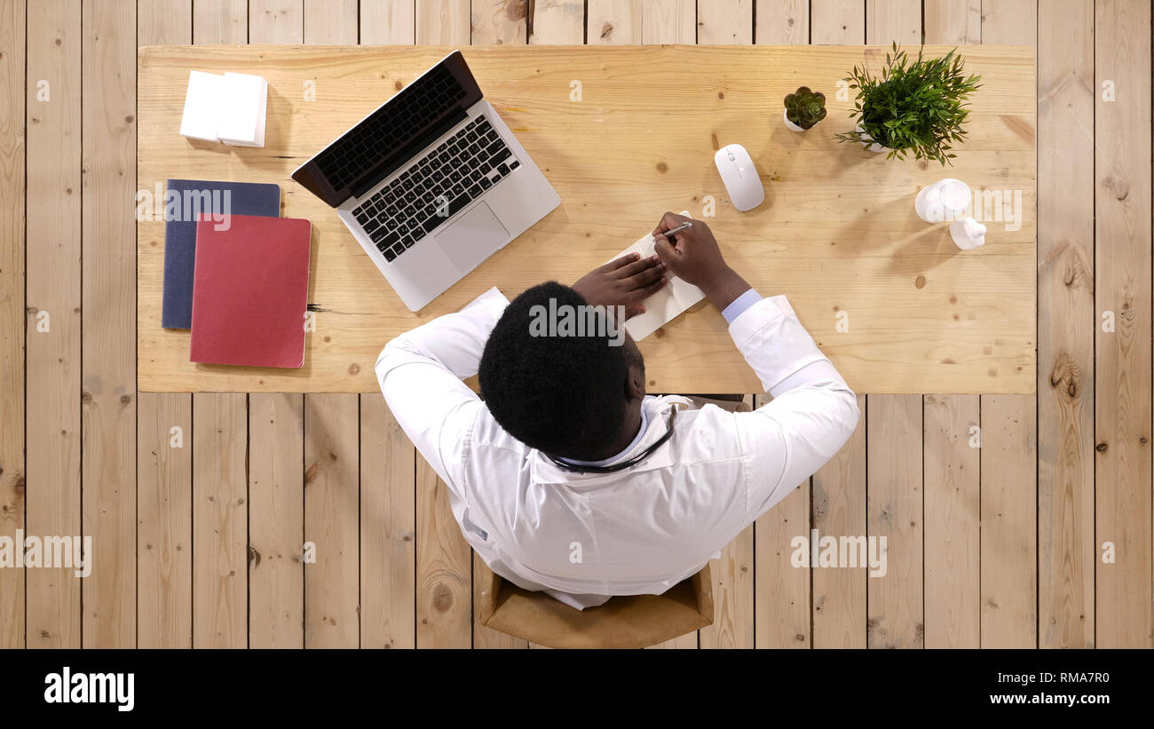 African American Doctor Making Notes Stock Photo - Alamy