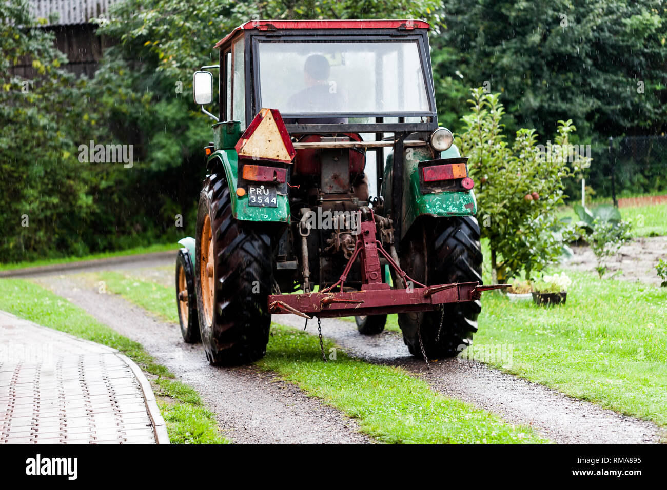 Four Wheeled Drive Mini Truck Hay Reaper in the Farm with Driver. Trees ...