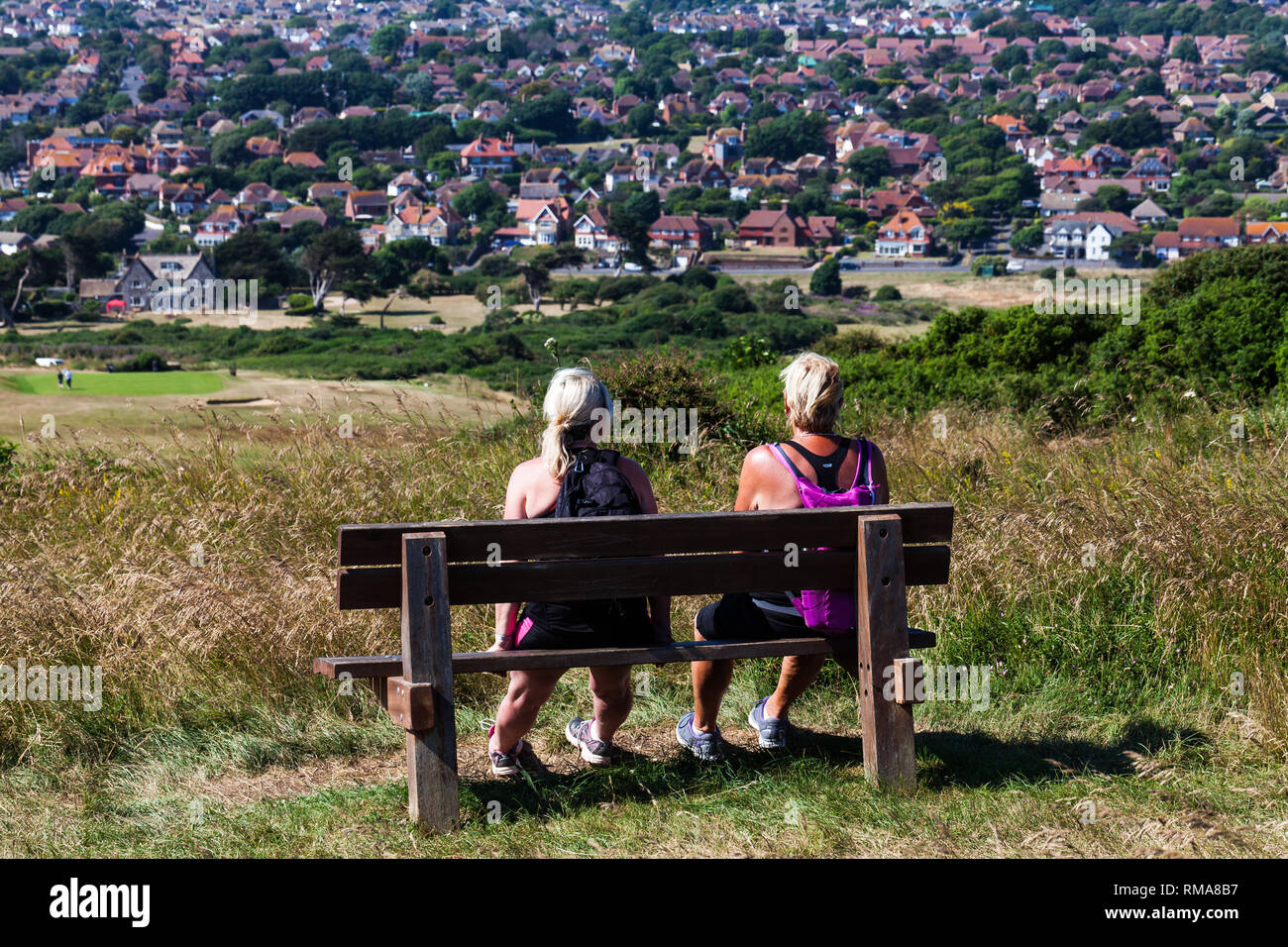 Brighton, UK - June 2018 Two Women Hikers Resting on Wooden Bench on ...