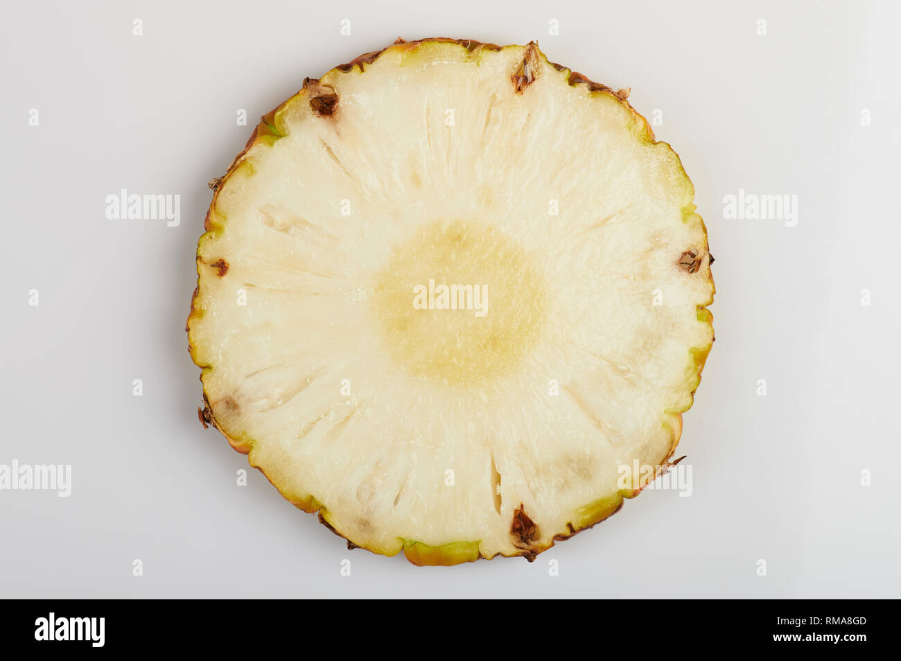 Round slice of fresh pineapple isolated on white background Stock Photo ...