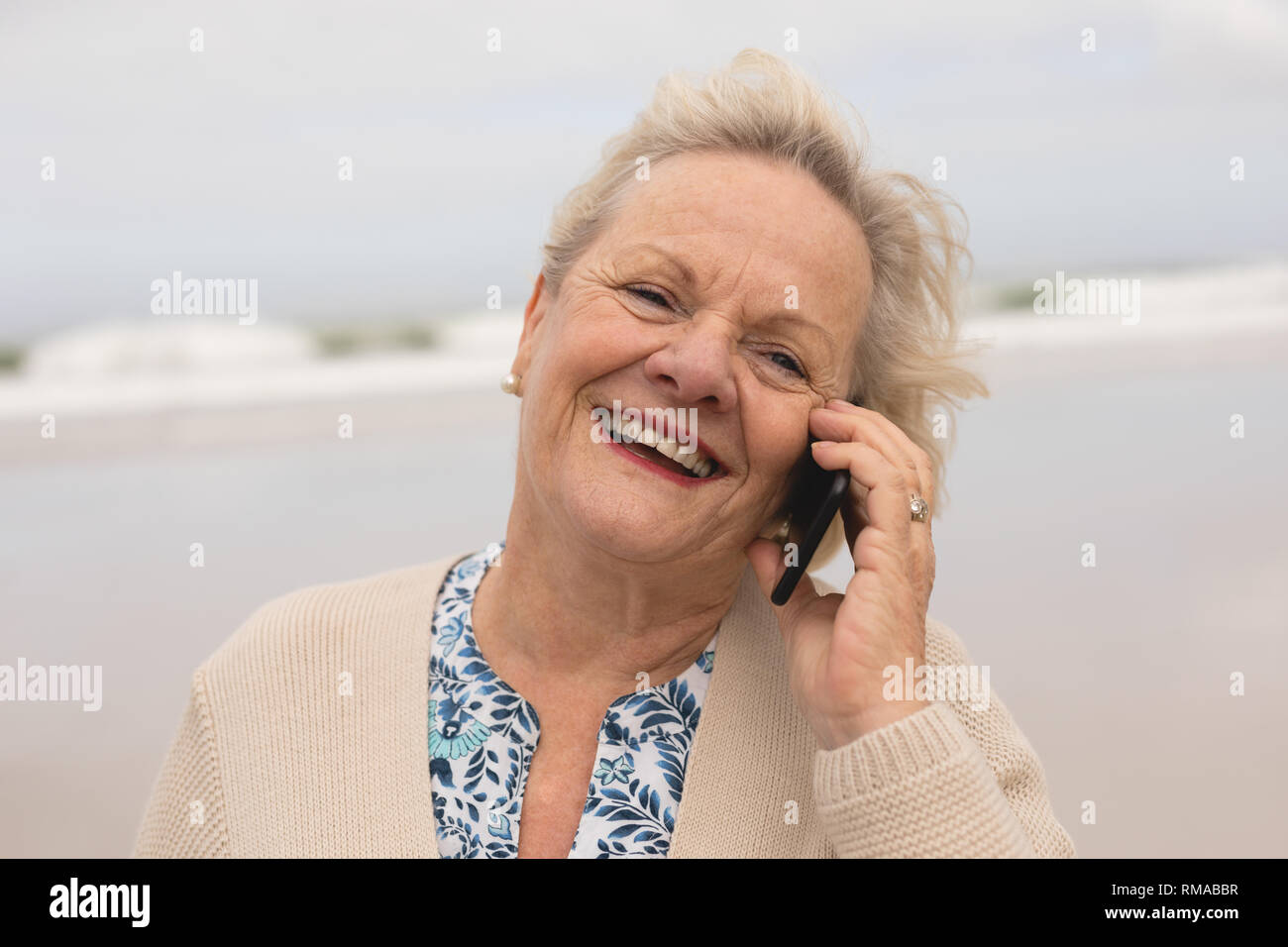Talking speaking at the beach hi-res stock photography and images - Alamy