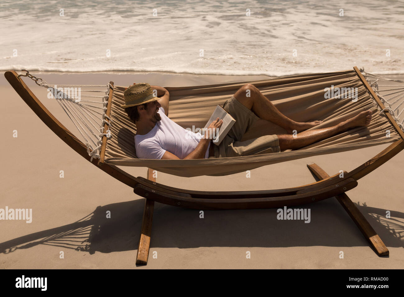 Young man relaxing hammock hi-res stock photography and images - Alamy