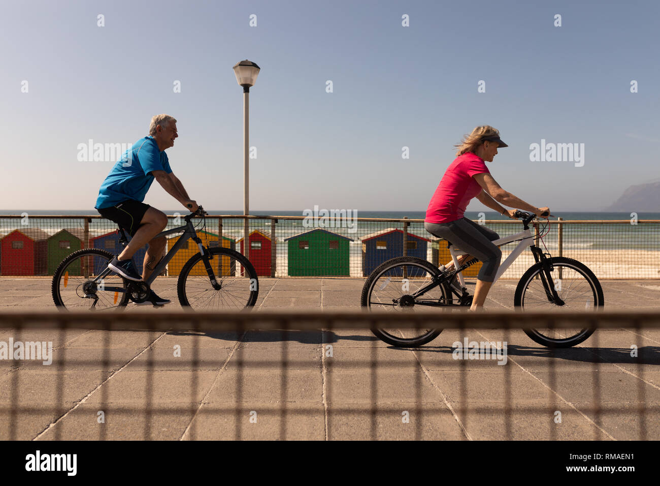 Pensioner riding bicycle at beach hi-res stock photography and images ...